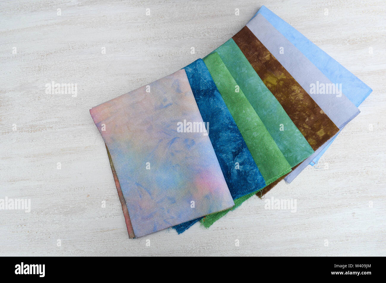 Multi-colored fabric cuts, folded overlap. Fabrics for sewing on a ...