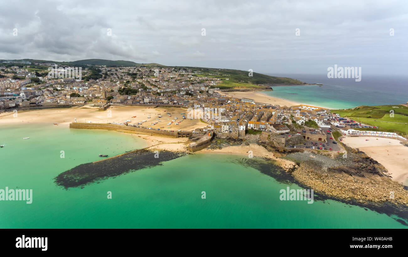 Aerial view over sandy beaches, fishing port, turquoise sea waters, of ...