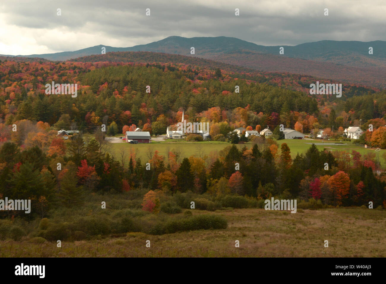 The town of Worcester, Vermont is viewed from a hill during foliage in ...