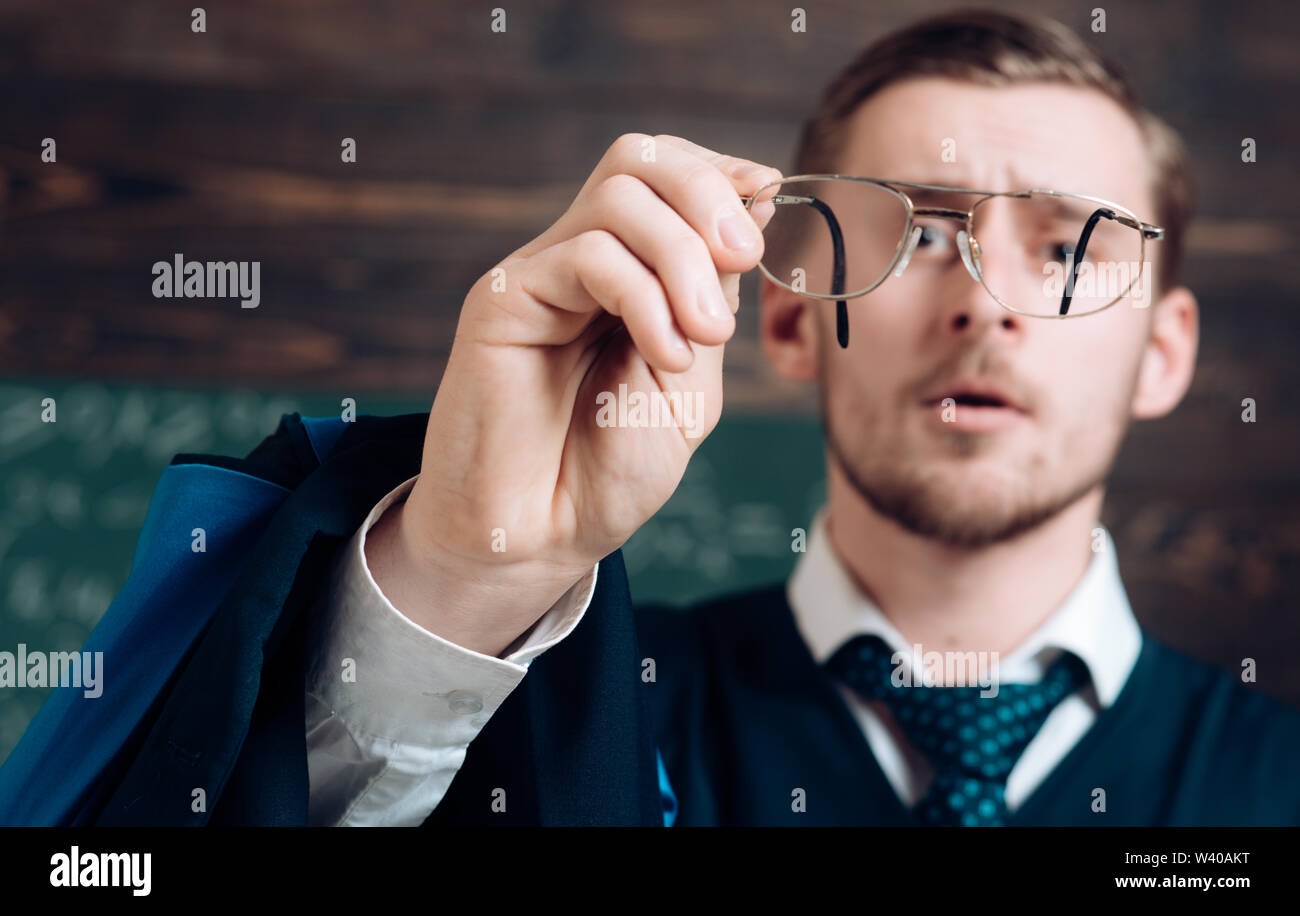 Let me see. Teacher formal wear and glasses looks concentrated ...