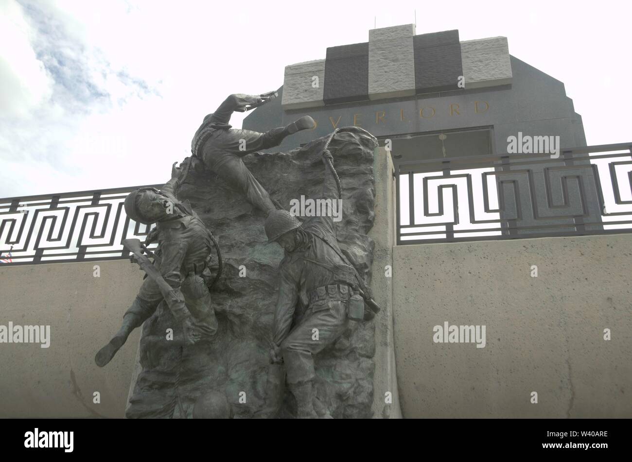 Statues of soldiers invading during D-Day are depicted at the Memorial ...