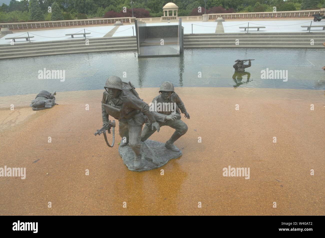 Statues of soldiers invading during D-Day are depicted at the Memorial ...