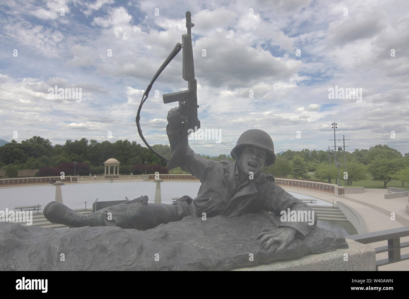 A statue of a soldier climbing a wall is displayed at the D-Day ...