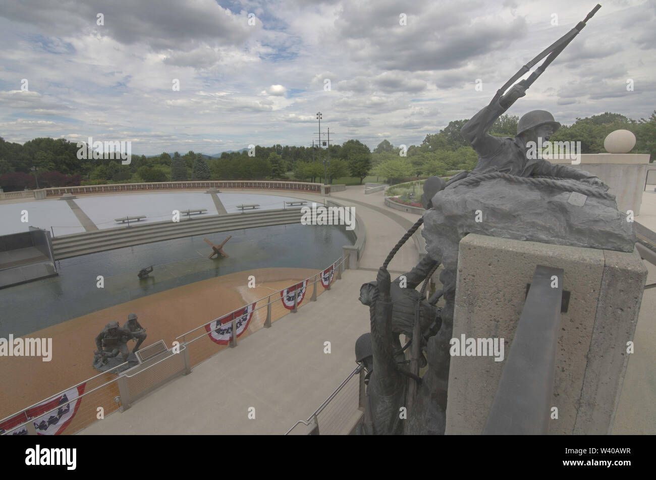 A statue of a soldier climbing a wall is displayed at the D-Day ...