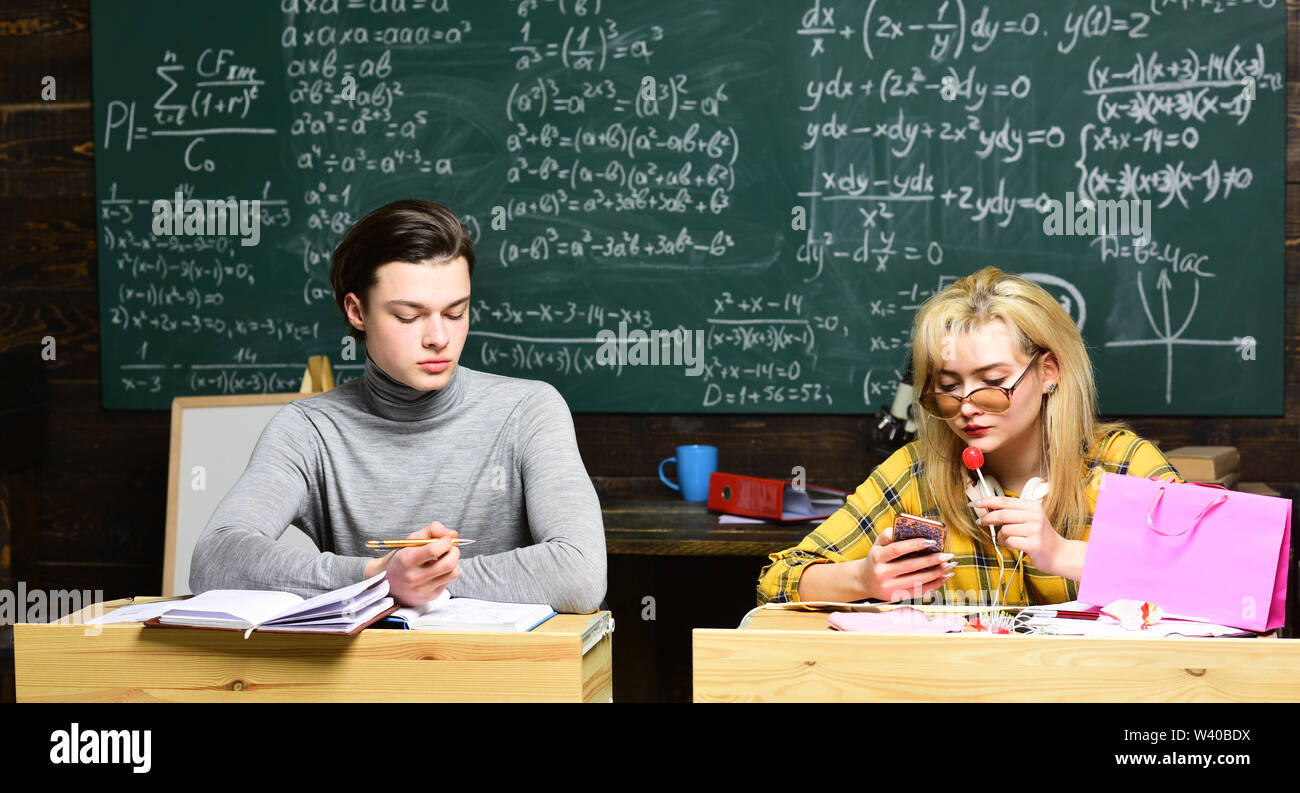 High school or college students studying and reading together in ...