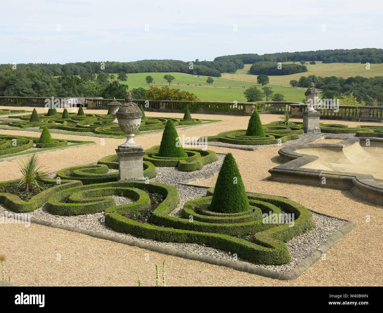 The gardens at Harewood House include a formal parterre with topiary ...