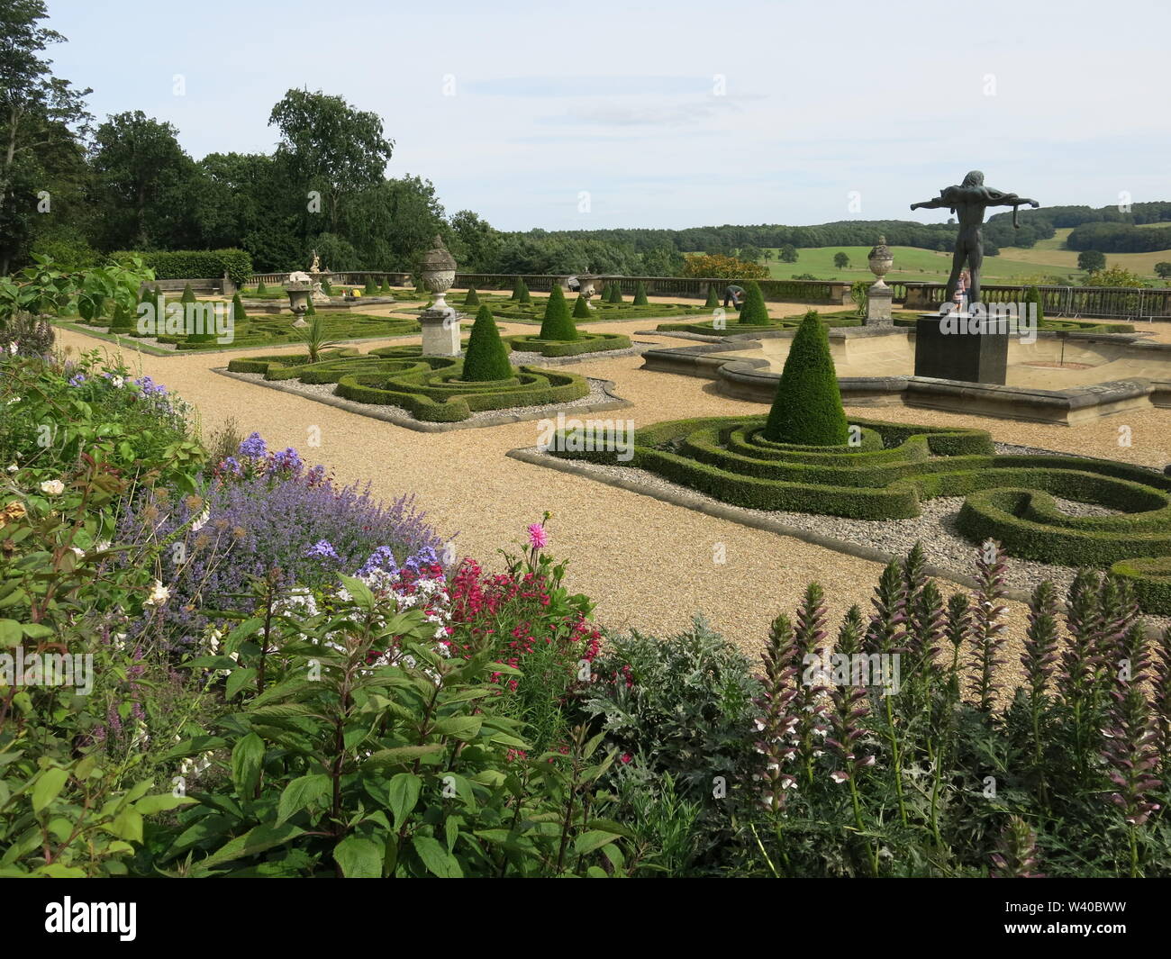 The gardens at Harewood House include a formal parterre with topiary ...