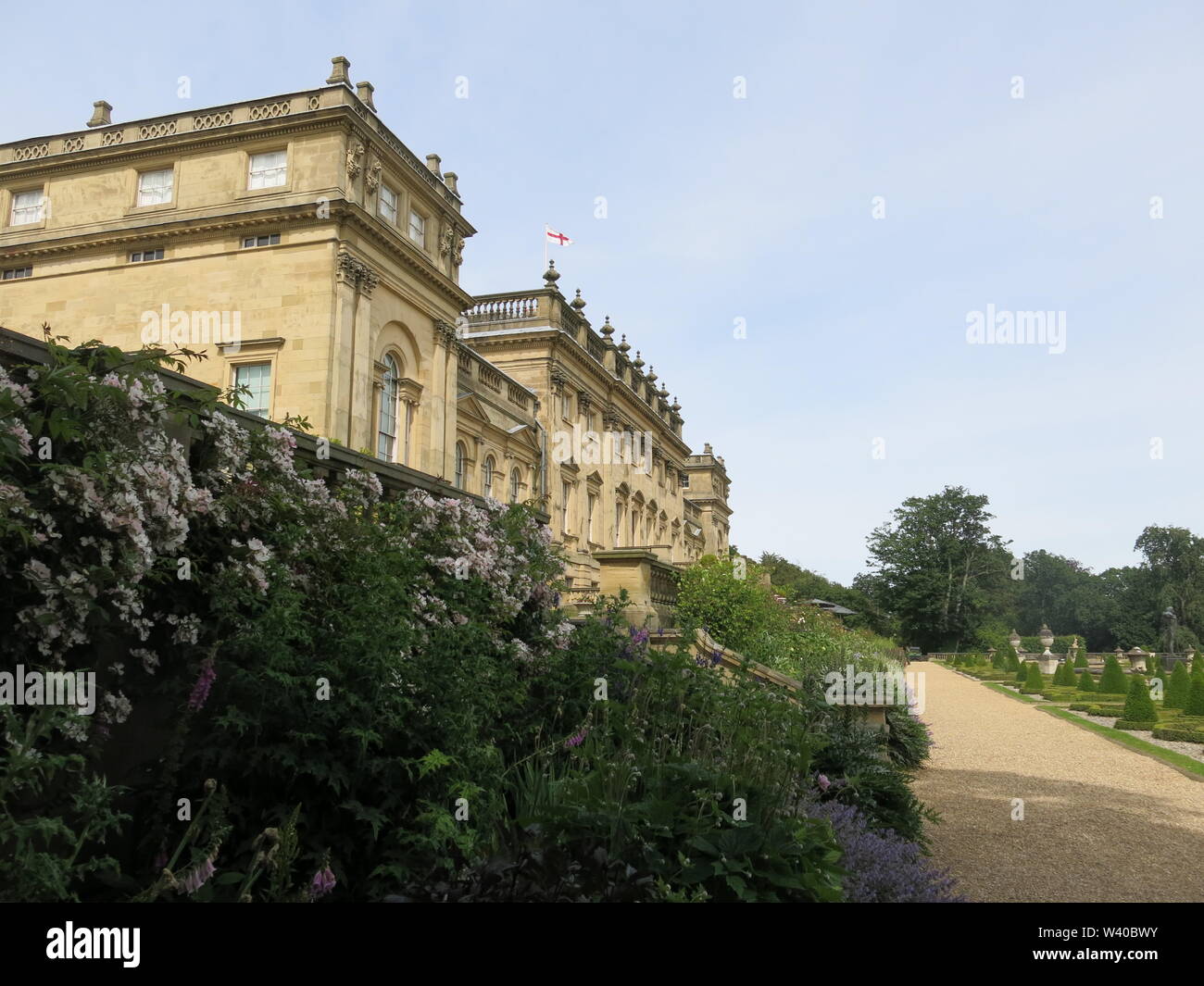 View of the topiary gardens, parterre, luscious planting and the ...