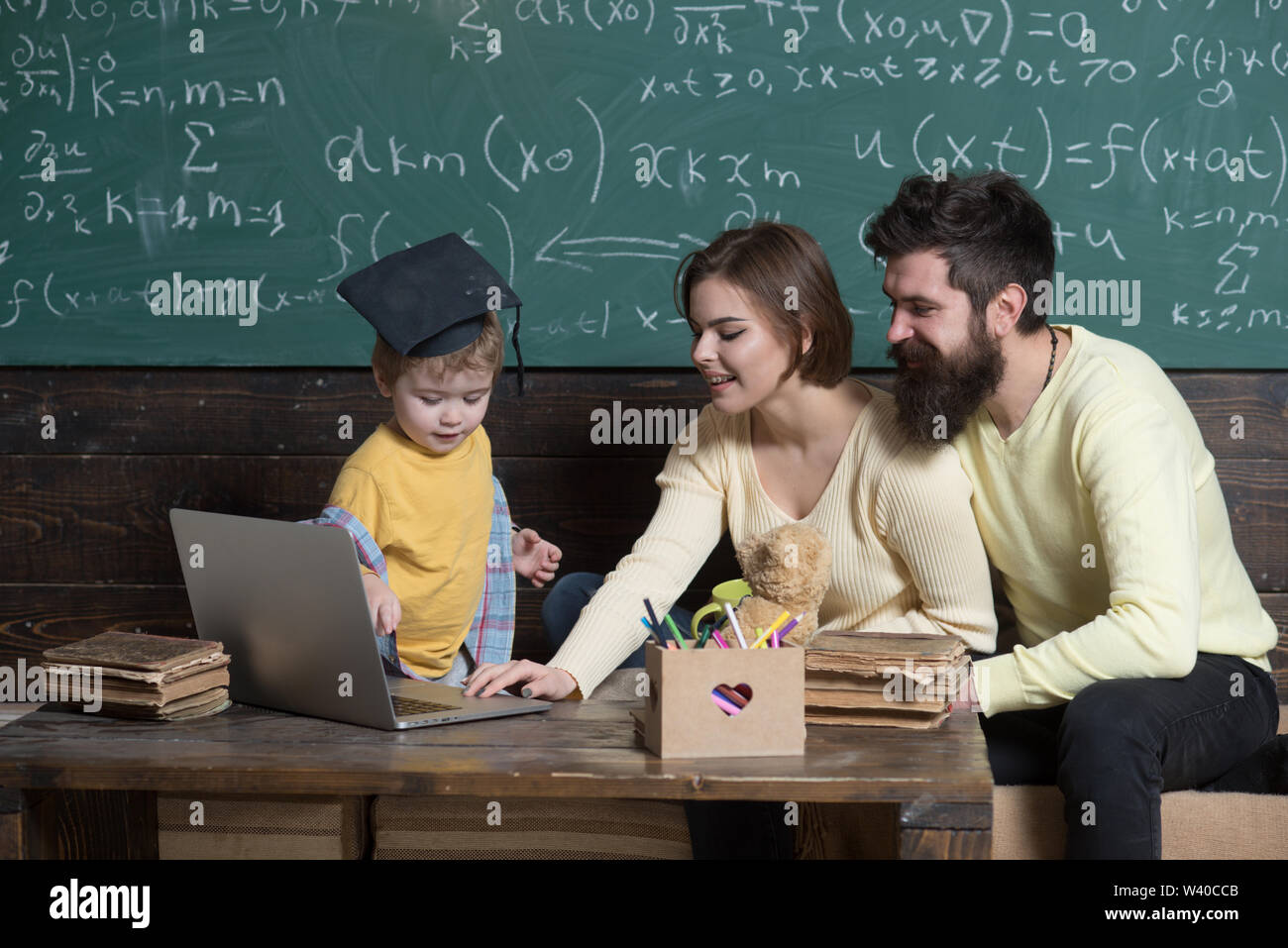 Technology concept. Family use computer technology in school lesson ...
