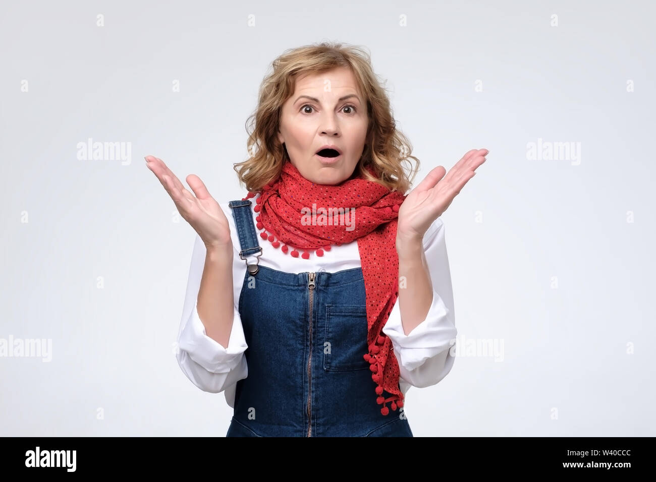 Mature woman pulling being shocked with news Stock Photo - Alamy