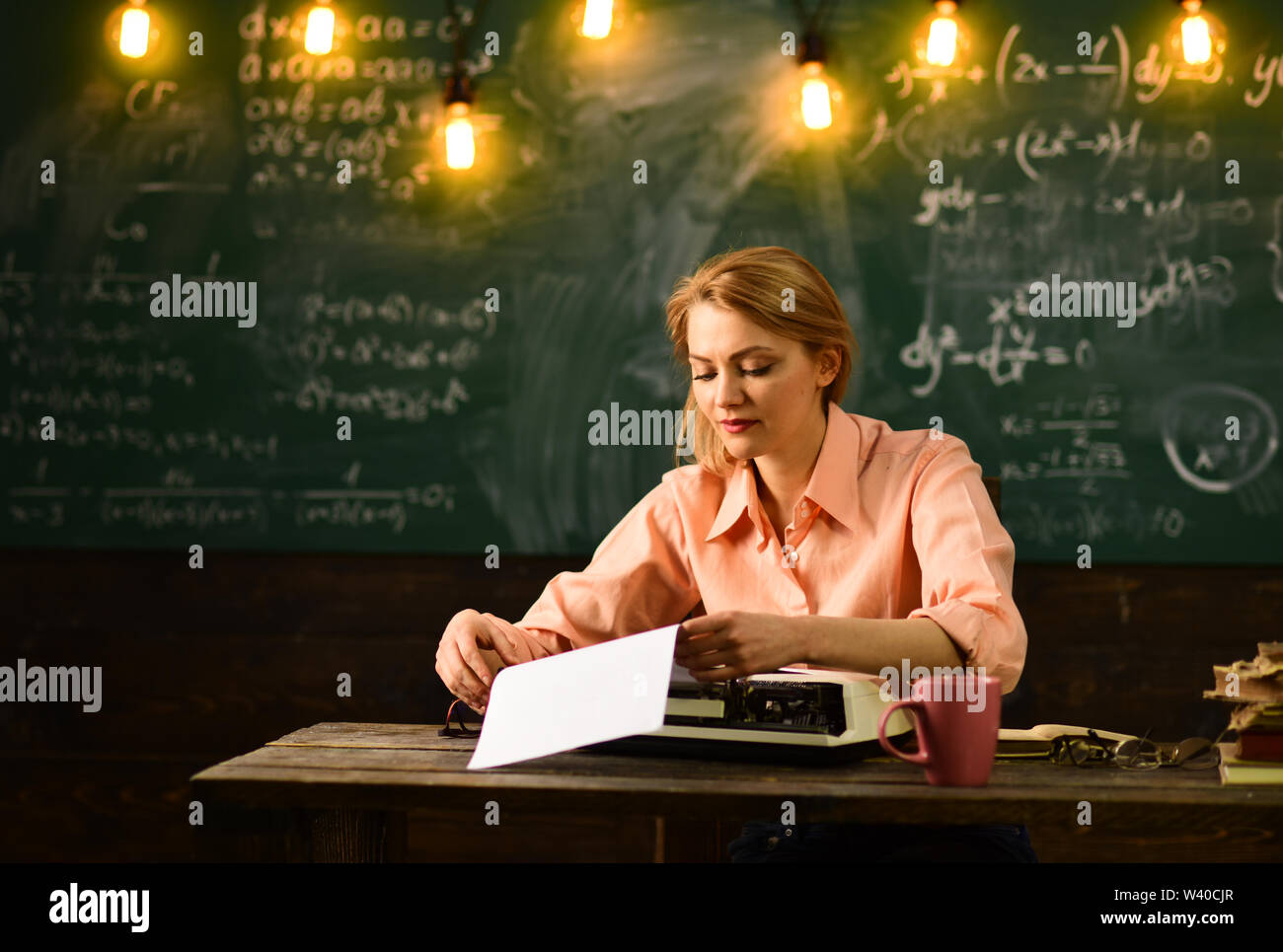 admission to school. woman writes documents for admission to school ...