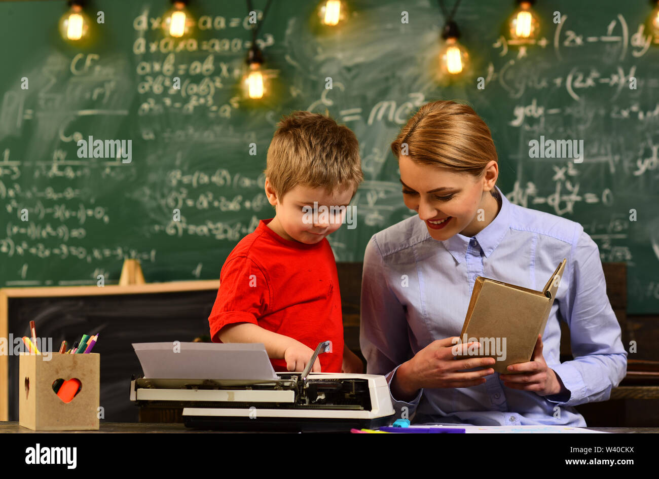 Teacher collaborates with colleagues, University students studying with ...