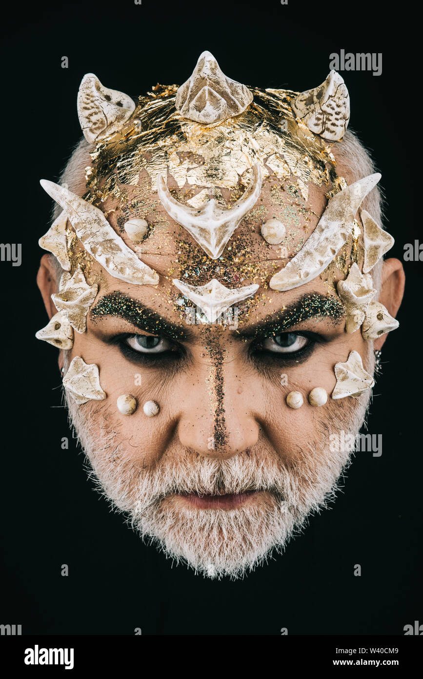 Man with golden reptilian skin and white beard. Monster with sharp ...