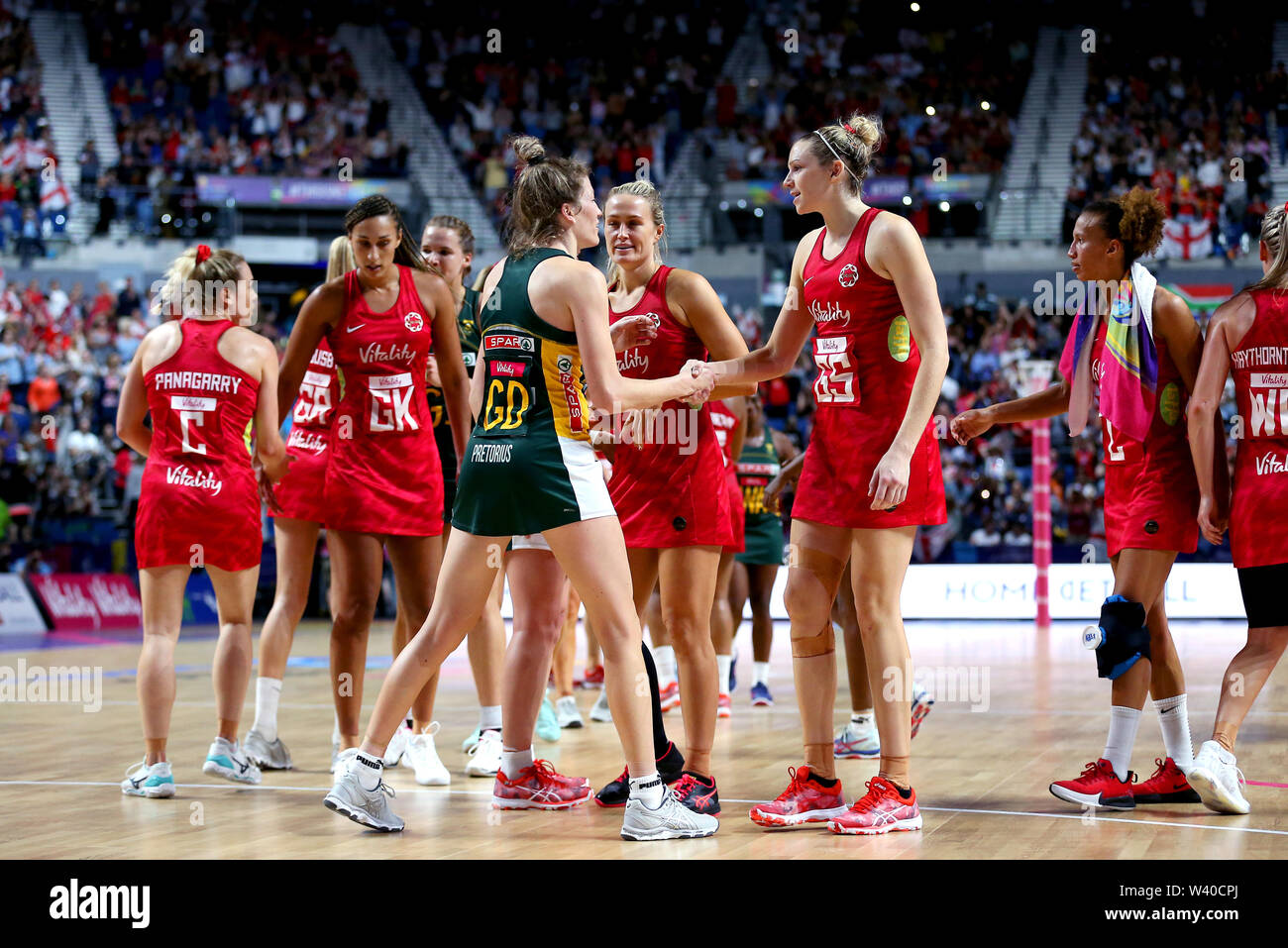 England's Joanne Harten shakes hands with South Africa's Karla ...