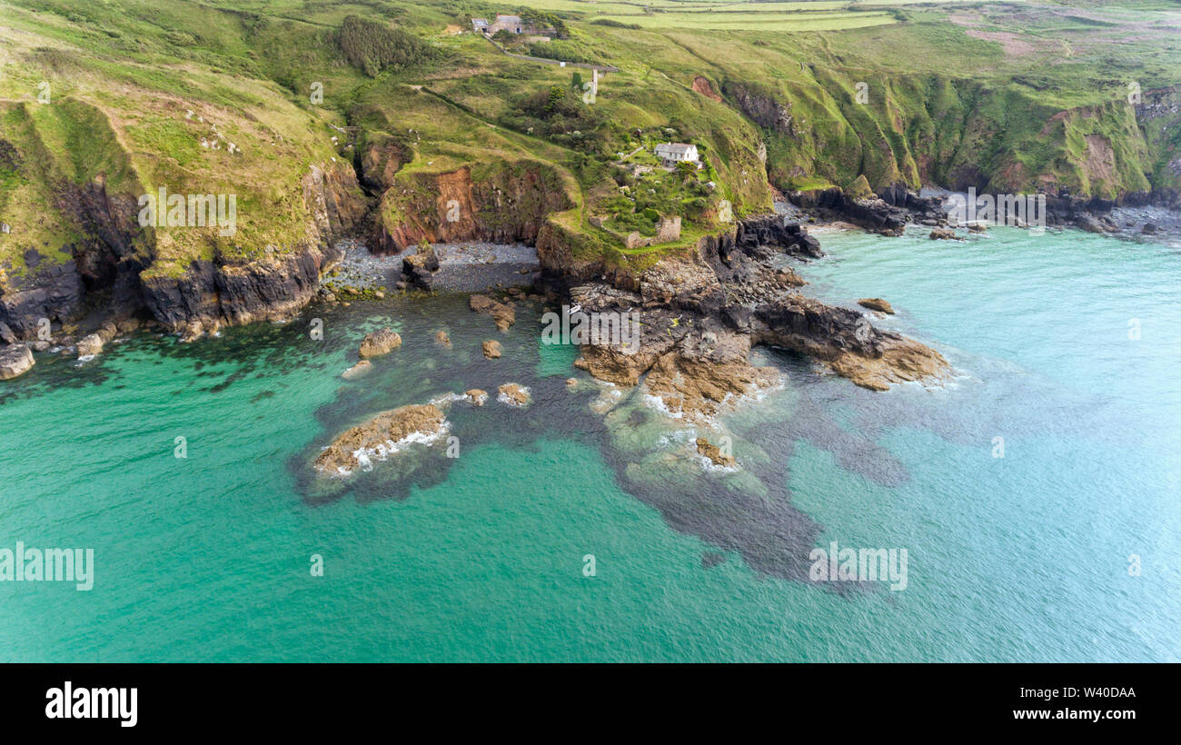 Aerial view of Cornish coastline with high cliffs, rocky shore, stone ...