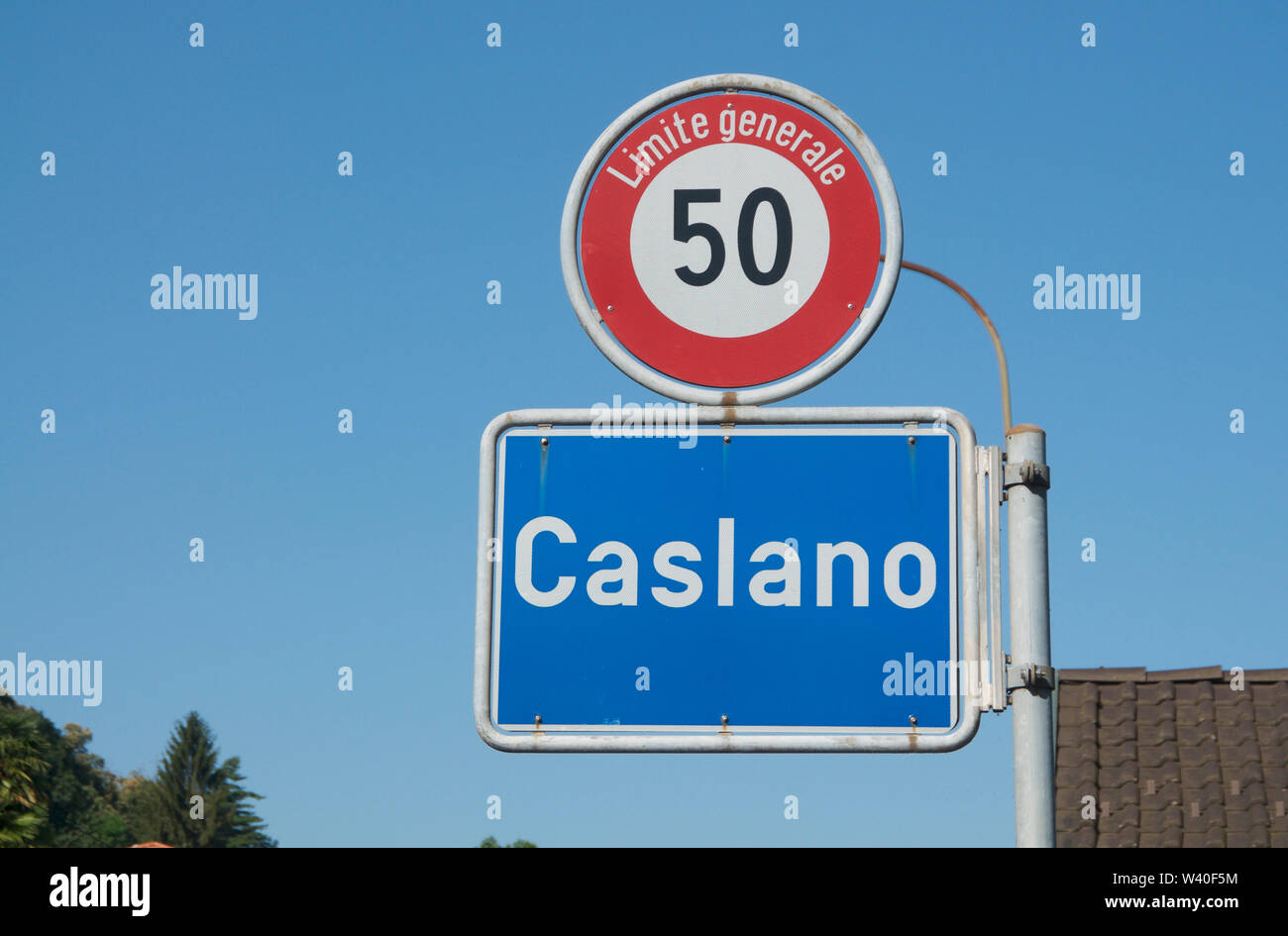 Close up picture of Caslano village road sign with a 50km general speed ...