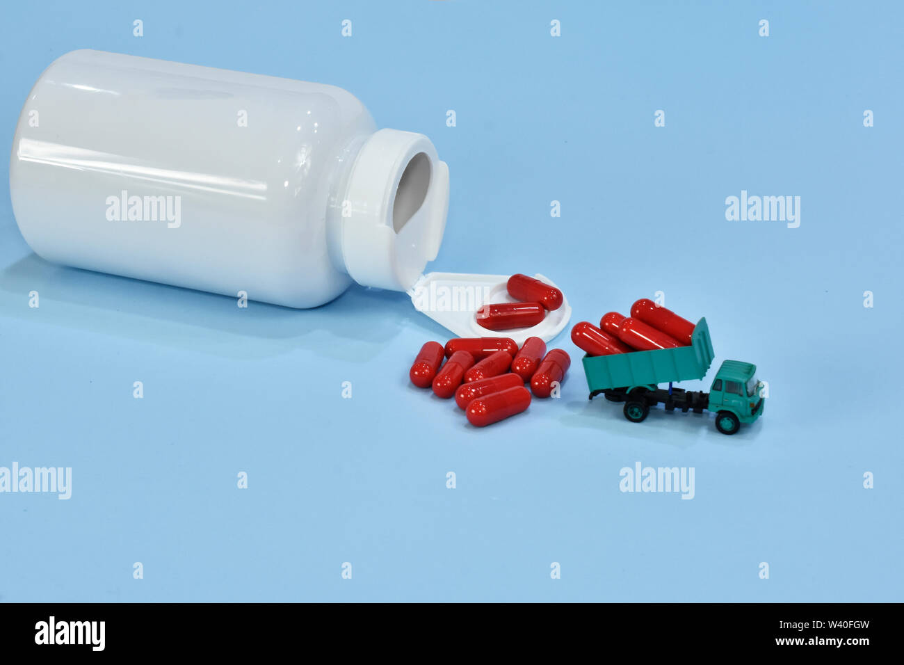 Capsules from bottle. Truck carrying some capsules. transportation of ...