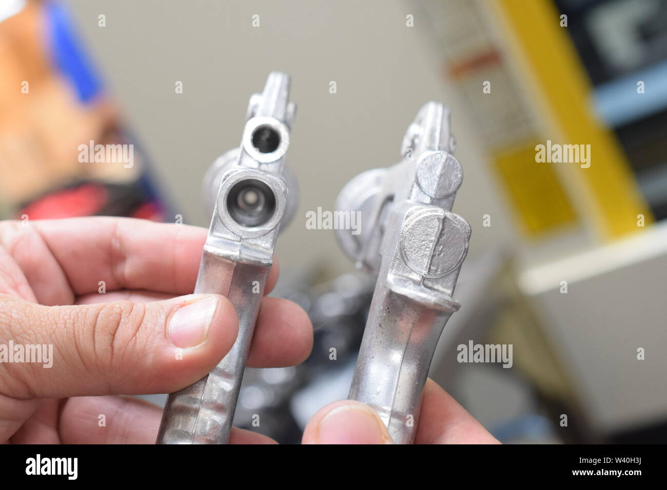 Before and after machining a spray gun in a factory Stock Photo - Alamy