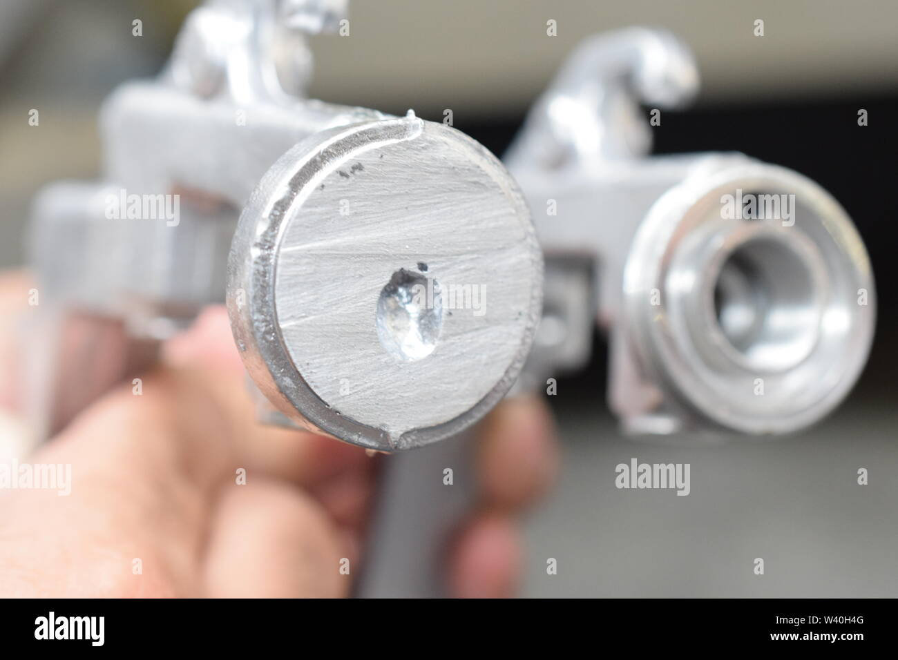 Before and after machining a spray gun in a factory Stock Photo - Alamy