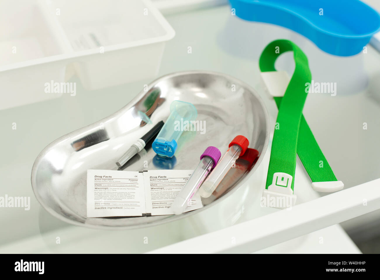 On a metal tray is a set for blood sampling for tests. Harness, test ...