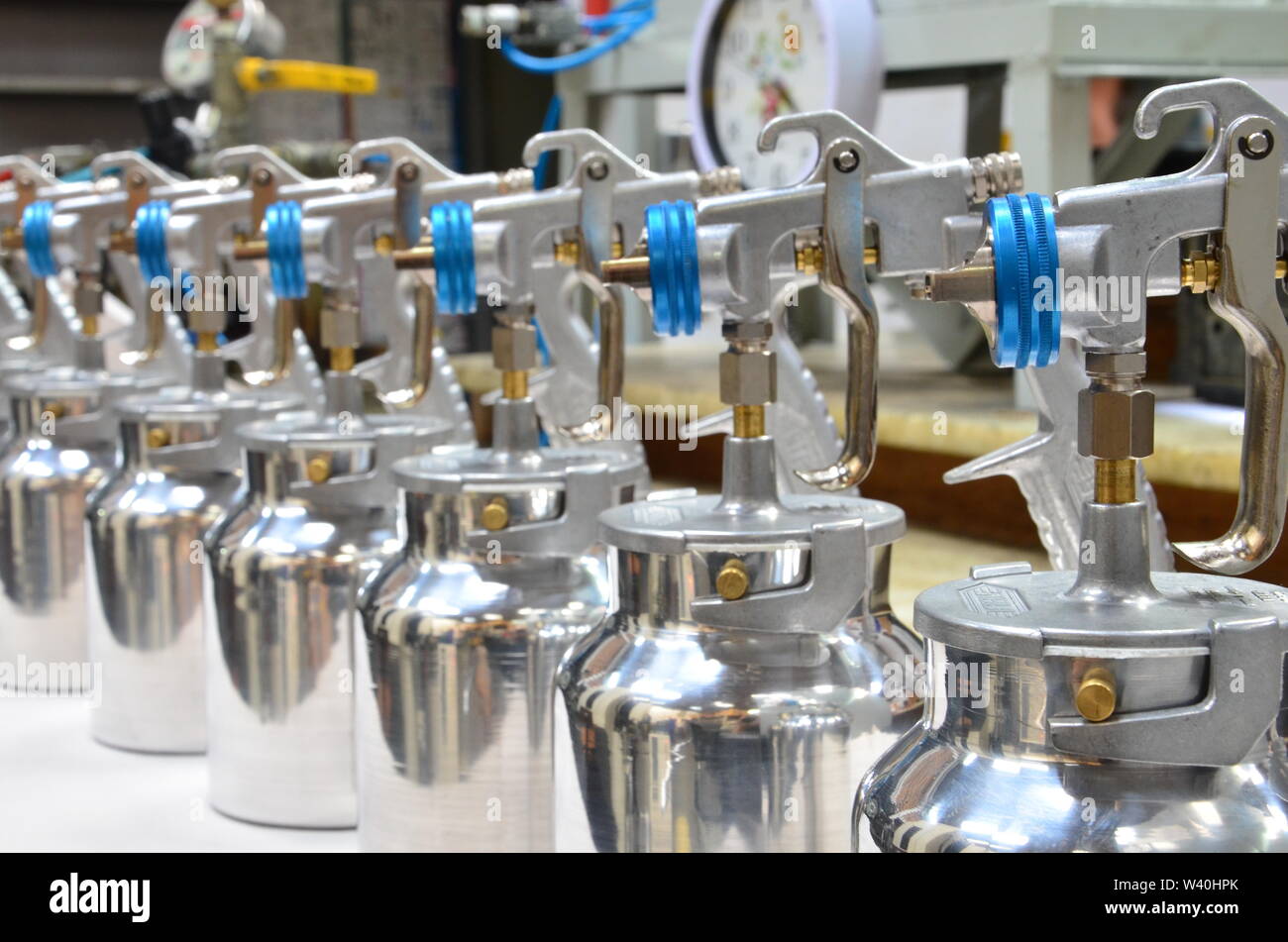 Series production of paint spray guns. Airbrushing factory Stock Photo ...