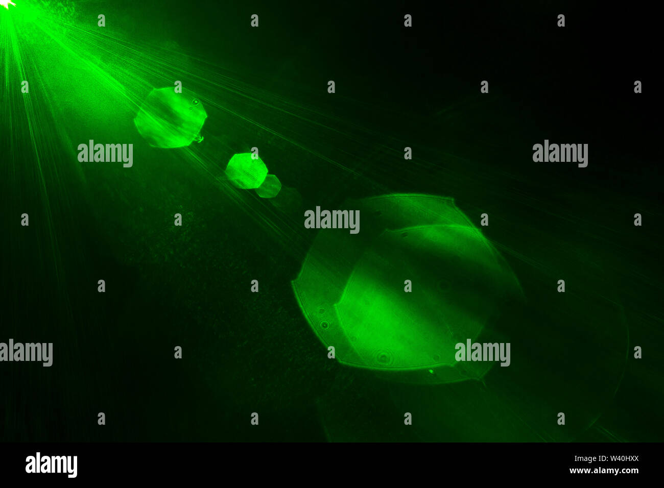 Camera lens flare by laser light create hexagons of objective iris ...