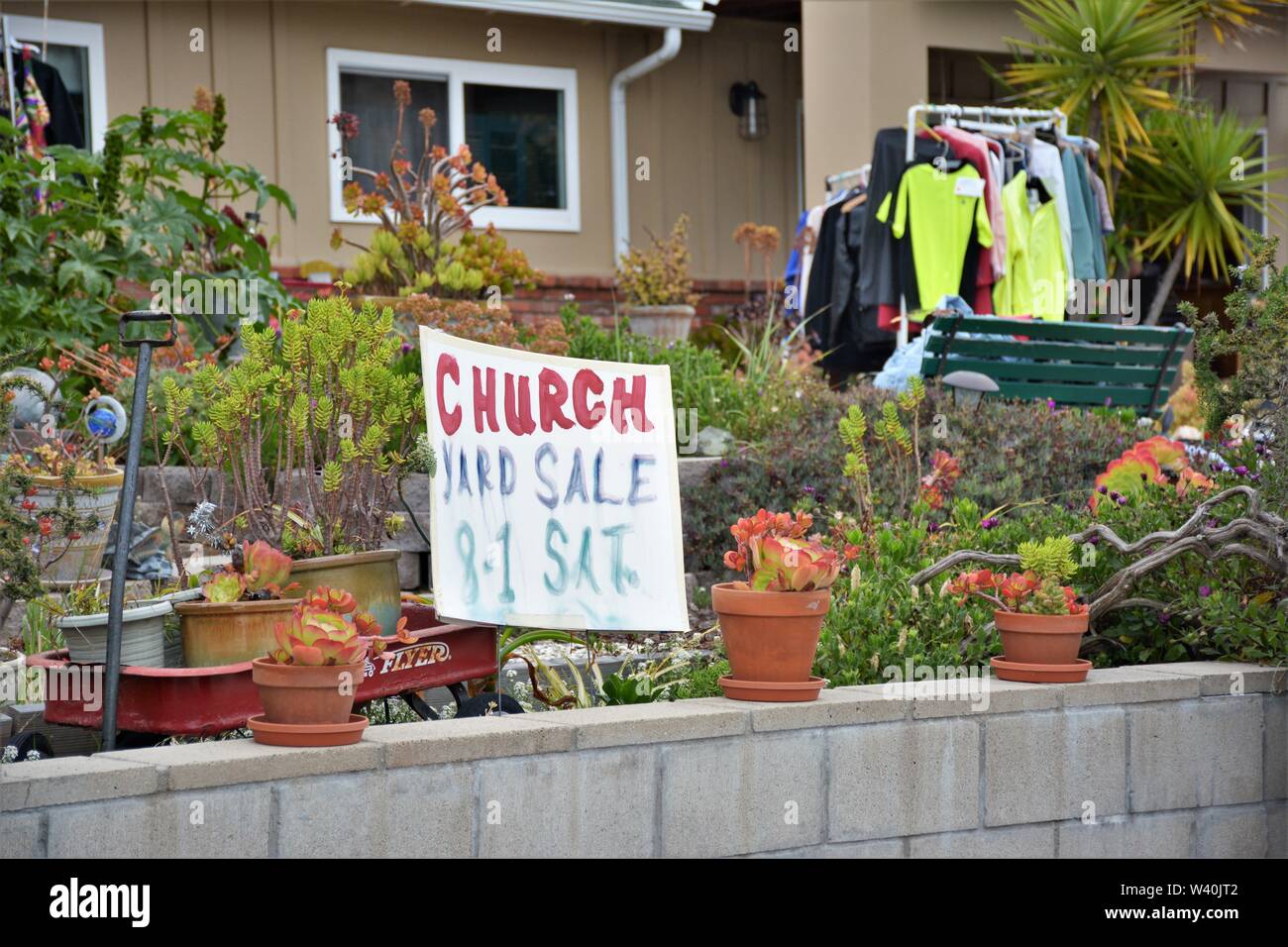 Sign for a yard sale of used items by a group of church members in ...