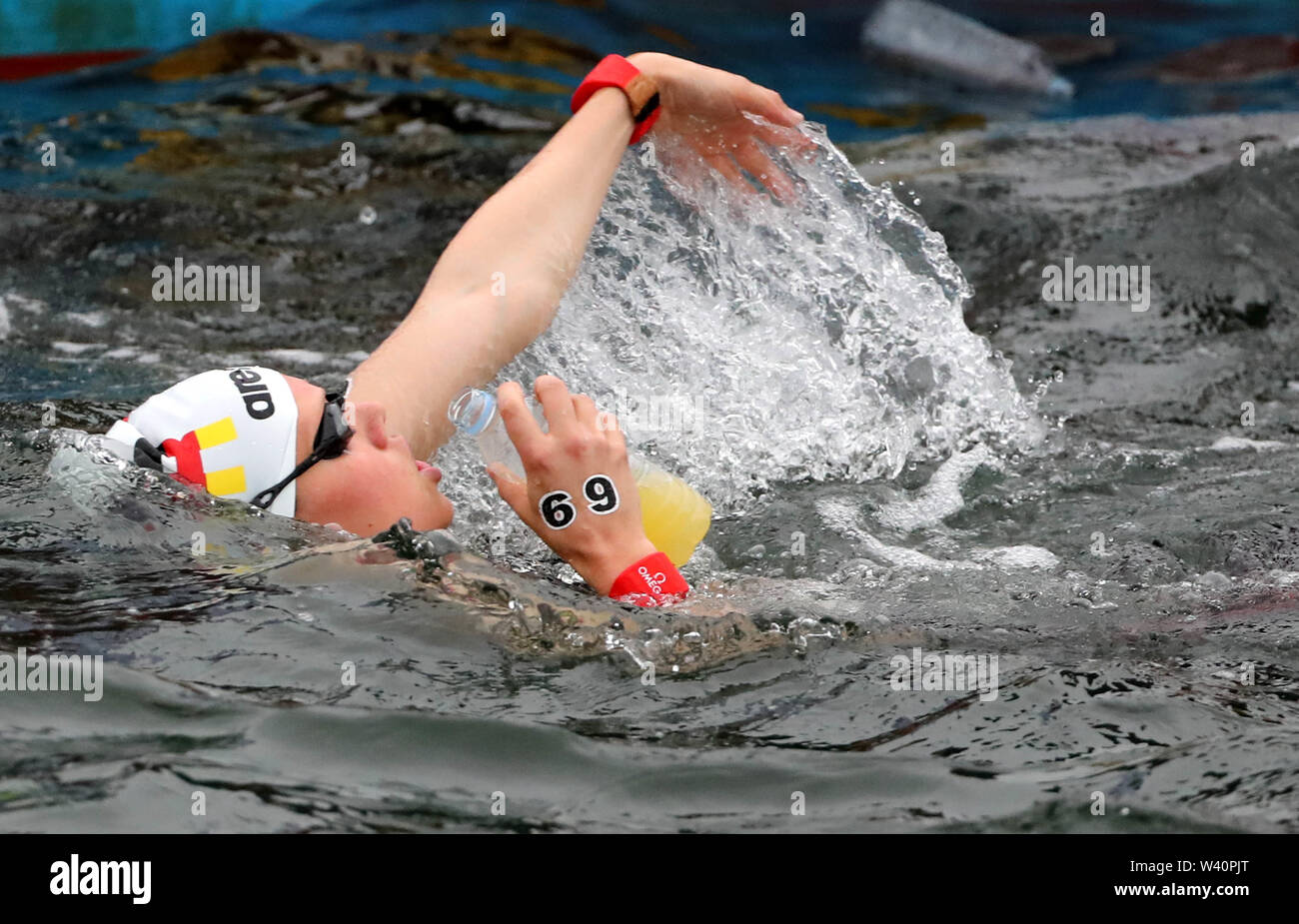 19th July, 2019. Thirsty! French open water swimmer Lisa Pou drinks a ...