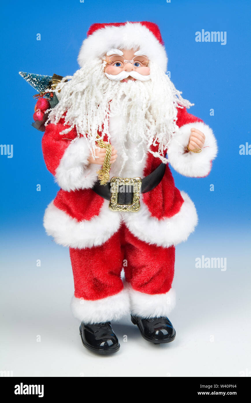 Santa Klaus statuette on a studio background Stock Photo - Alamy