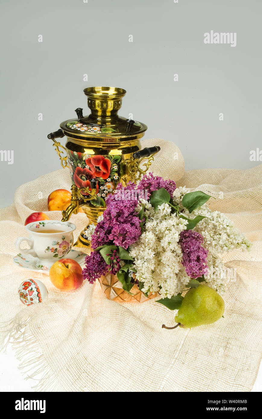 Still life with bouquet of flowers and accessories on a studio ...