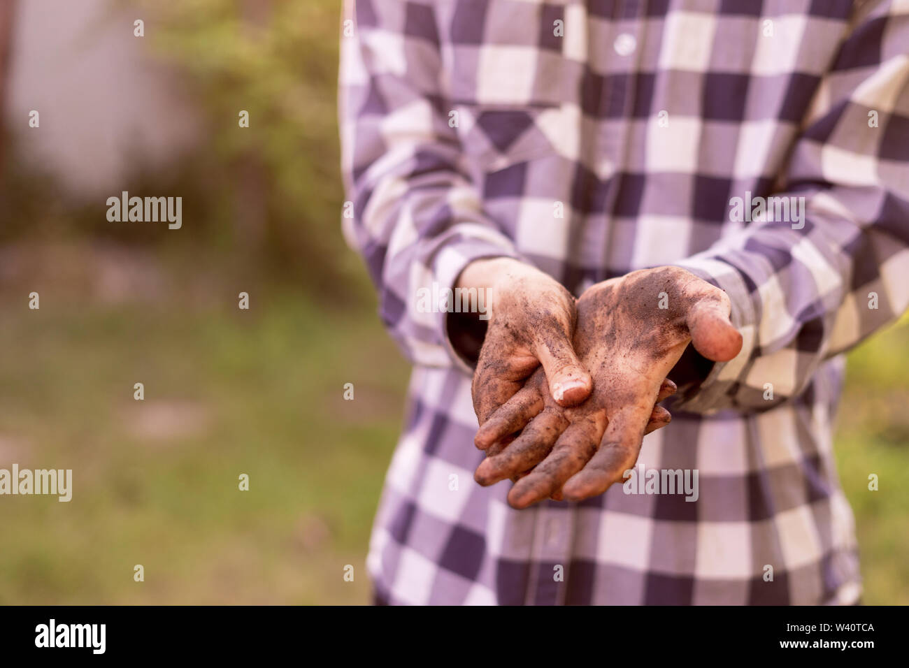 dirty working farmer hands in soil standing in garden Stock Photo - Alamy