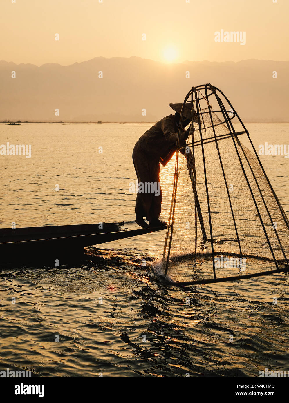 Inle Lake, Myanmar - Feb 16, 2016. Intha man using the unique methods ...
