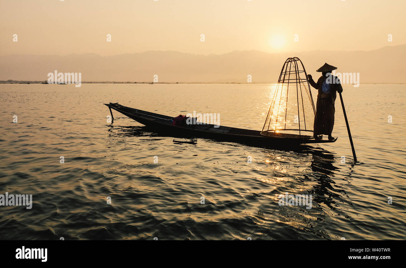 Inle Lake, Myanmar - Feb 16, 2016. Intha man using the unique methods ...