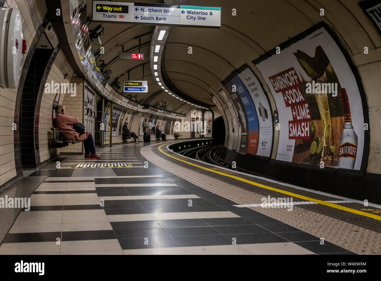 LONDON, ENGLAND, DECEMBER 10, 2018: People waiting for the train at the ...