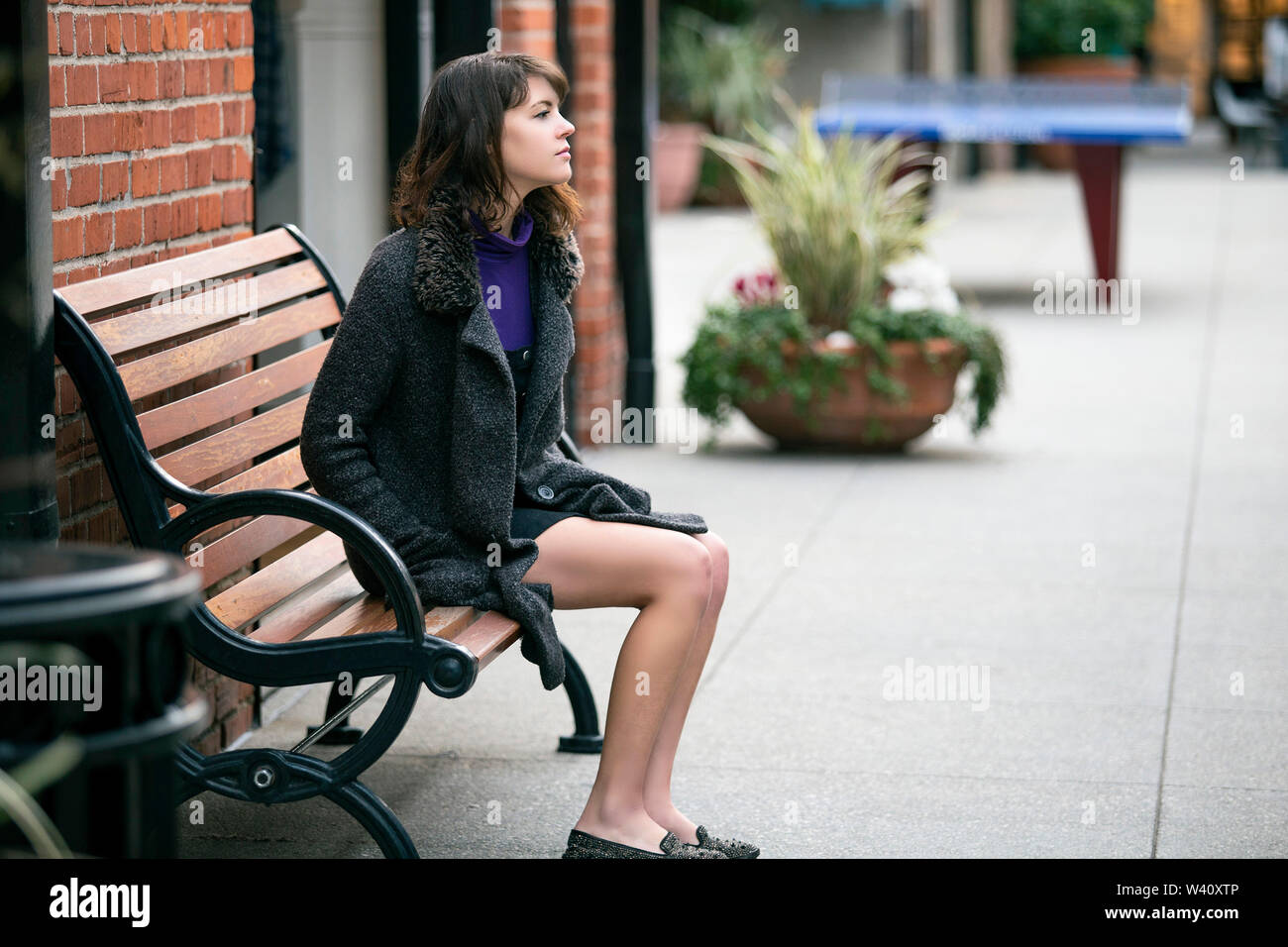 Bored at a bus station hi-res stock photography and images - Alamy