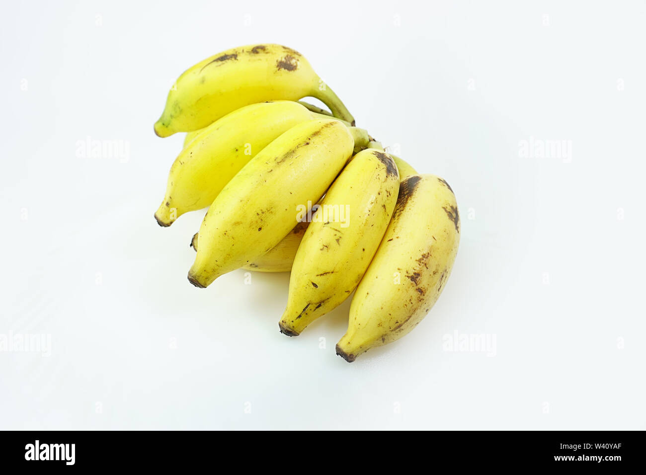 Small Yellow Bananas isolated on white background Stock Photo - Alamy