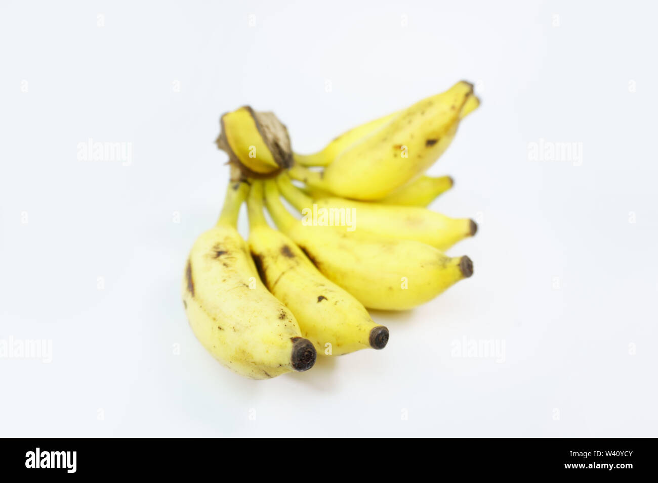 Small Yellow Bananas isolated on white background Stock Photo - Alamy