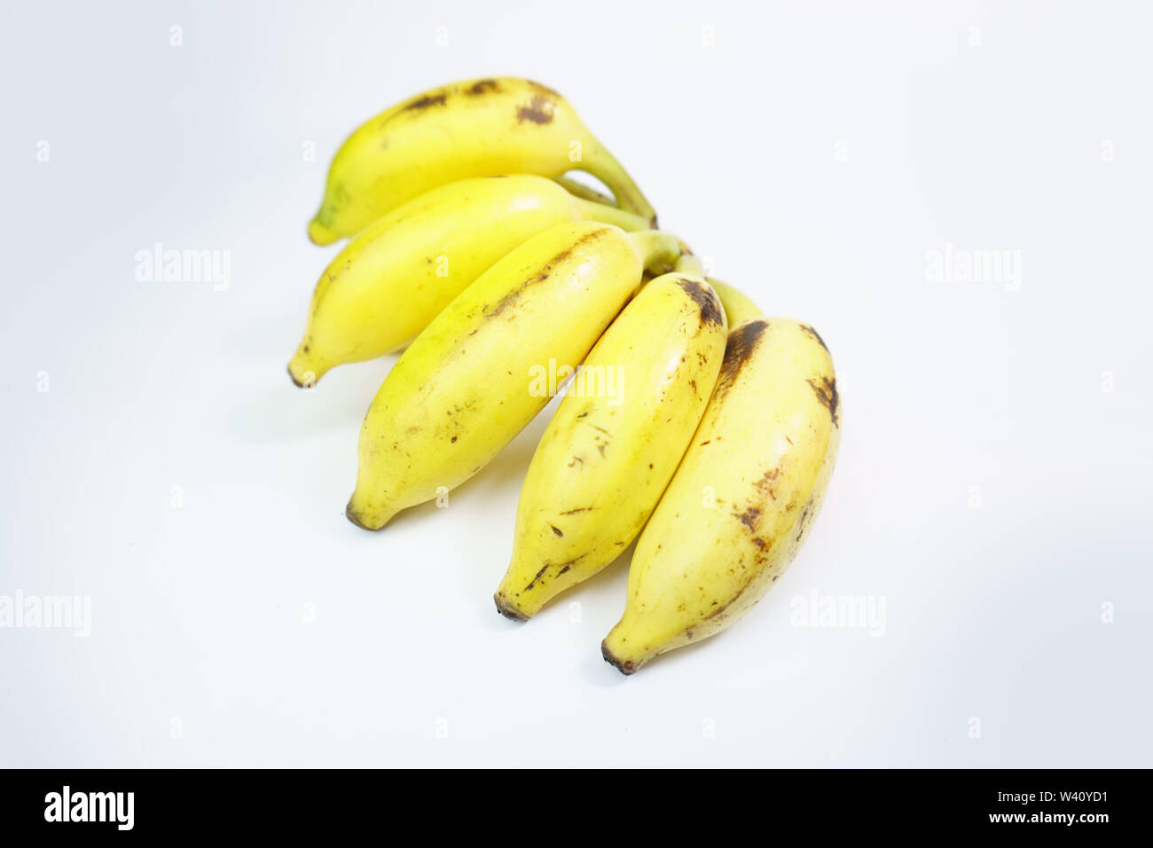 Small Yellow Bananas isolated on white background Stock Photo - Alamy
