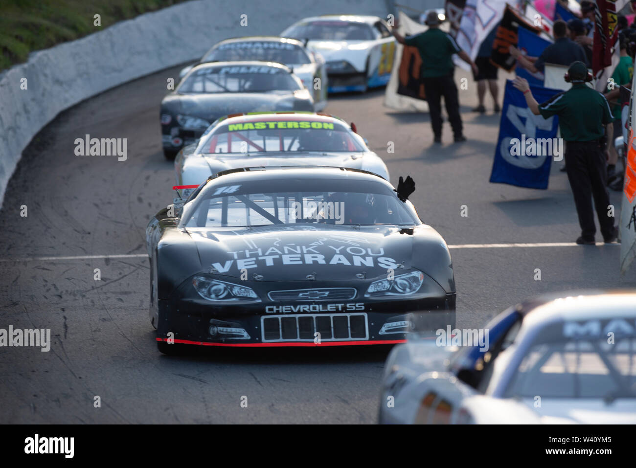 Racing Governor Vermont Governor Phil Scott puts his hand out of his ...
