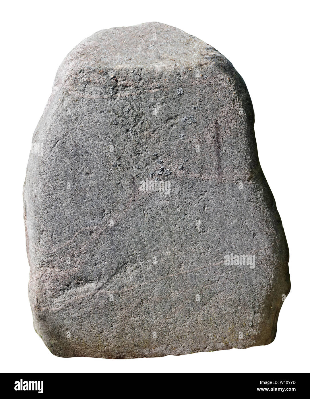 Long big vertical mossy monument of rough aged red granite stone ...