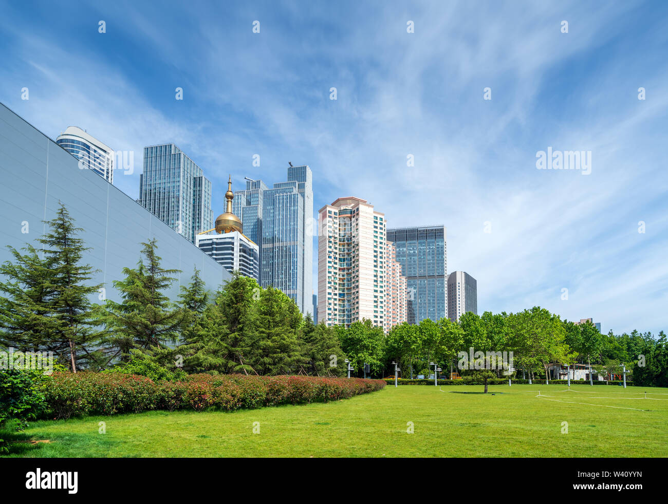 High-rise buildings near the lawn, Qingdao, China Stock Photo - Alamy