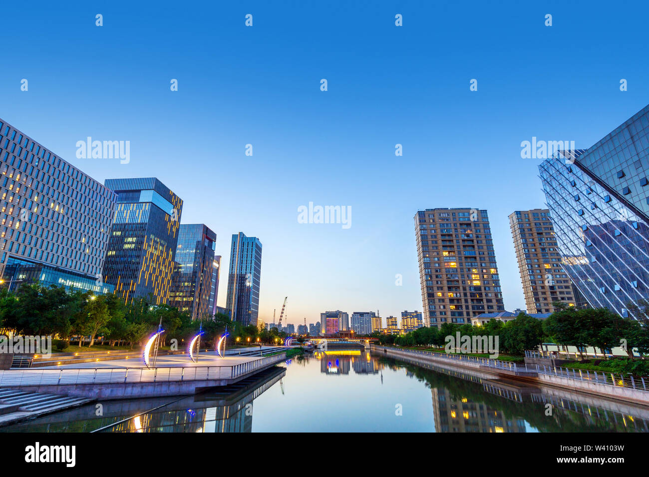Modern city skyline, Ninbo, China at night Stock Photo - Alamy