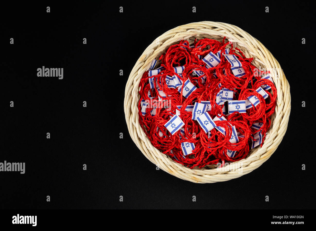 Red thread on a black background in the cart Stock Photo - Alamy