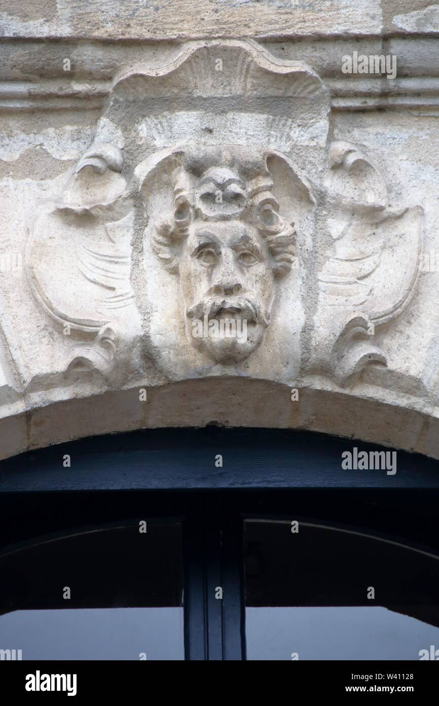 typical sculpted mask on the facade of a palace at Bordeaux, France ...
