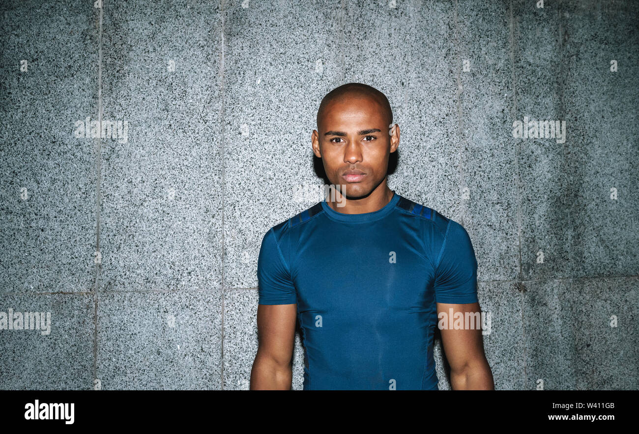 Image of a handsome strong african sports man at night outoors posing ...