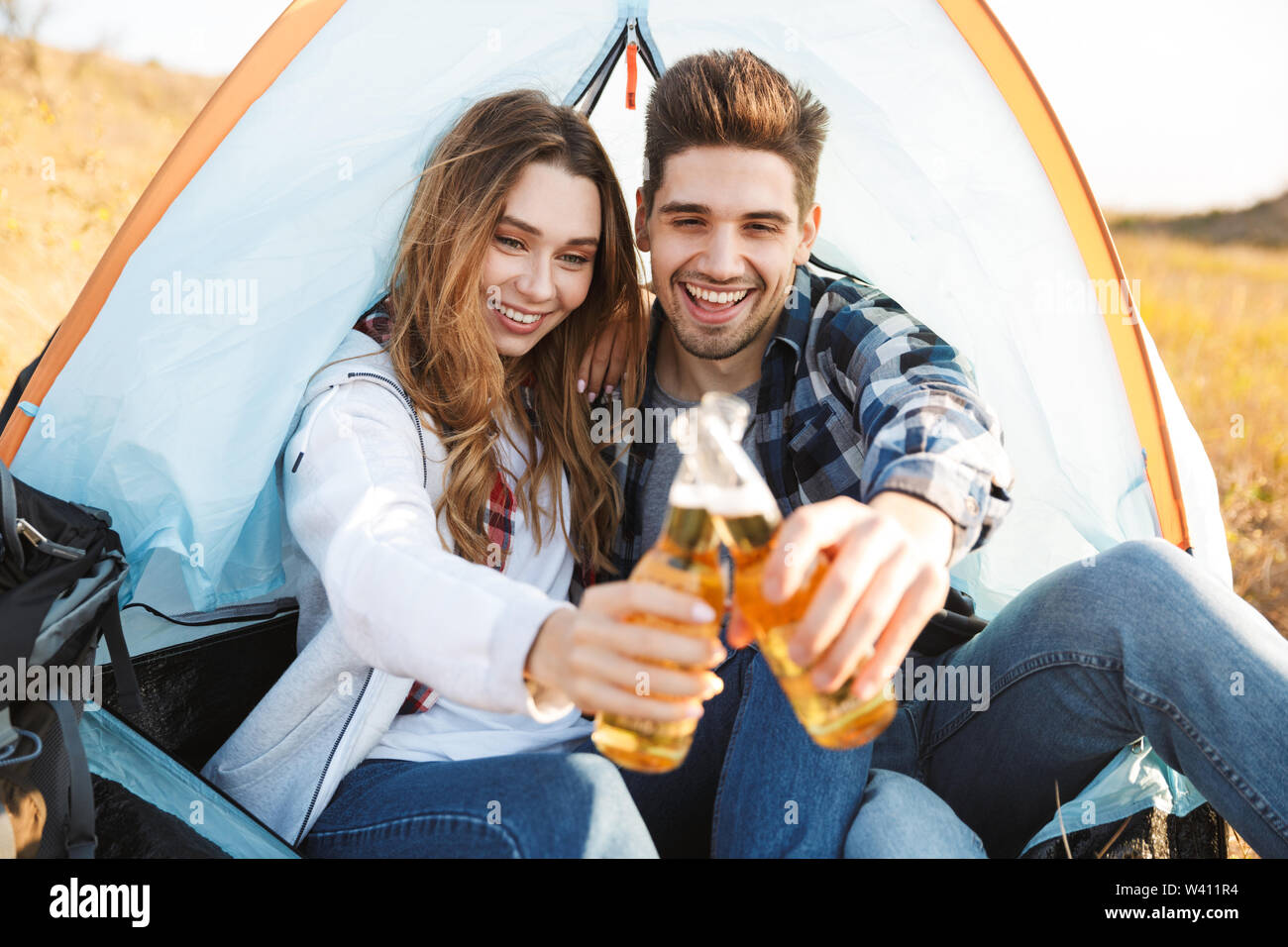 Photo of happy young loving couple outside in free alternative vacation ...