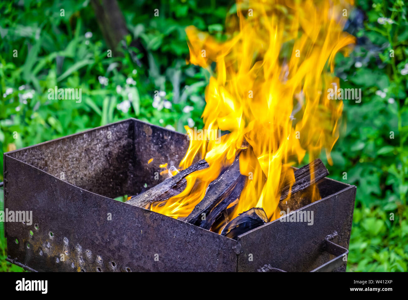 Fire lit in mangal before meat preparation closeup Stock Photo - Alamy