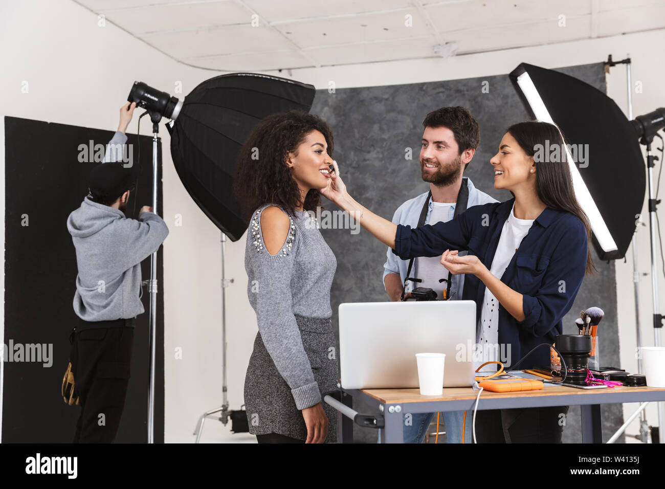 Portrait of young multiethnic people men and women talking while ...
