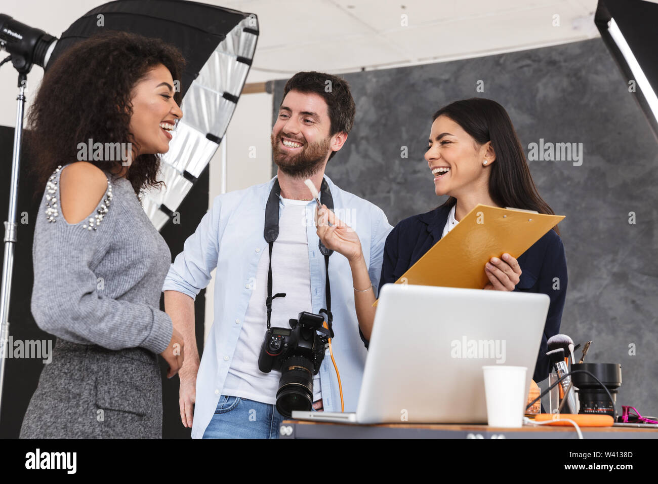 Portrait of happy multiethnic people man and women talking while ...
