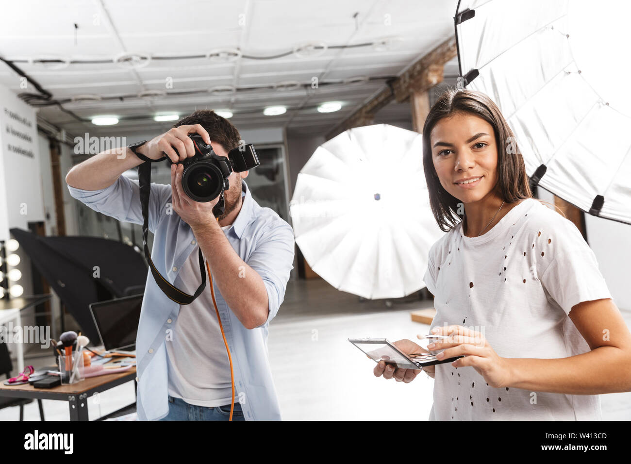 Portrait of young fashion team man and woman photo shooting model with ...